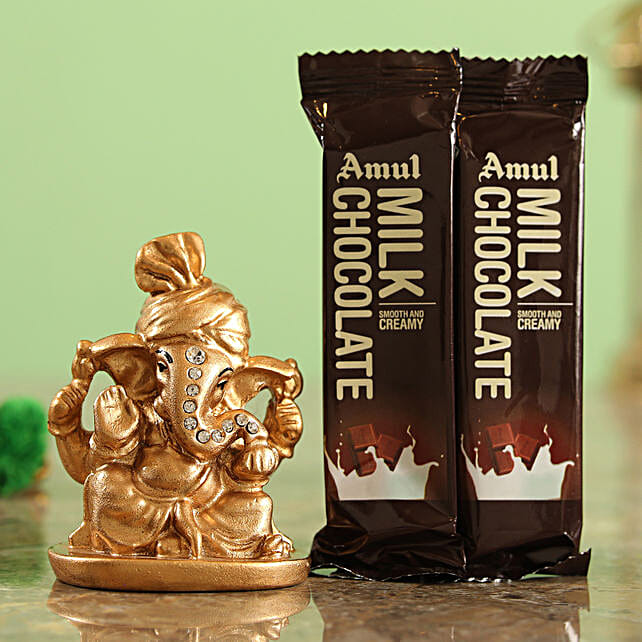 Buy/Send Amul Flowwrap Chocolates & Golden Ganesha Idol Combo Online- FNP